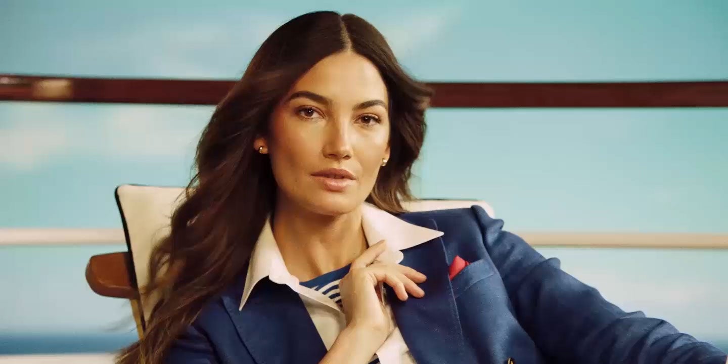 Video of models in orange and navy outfits.